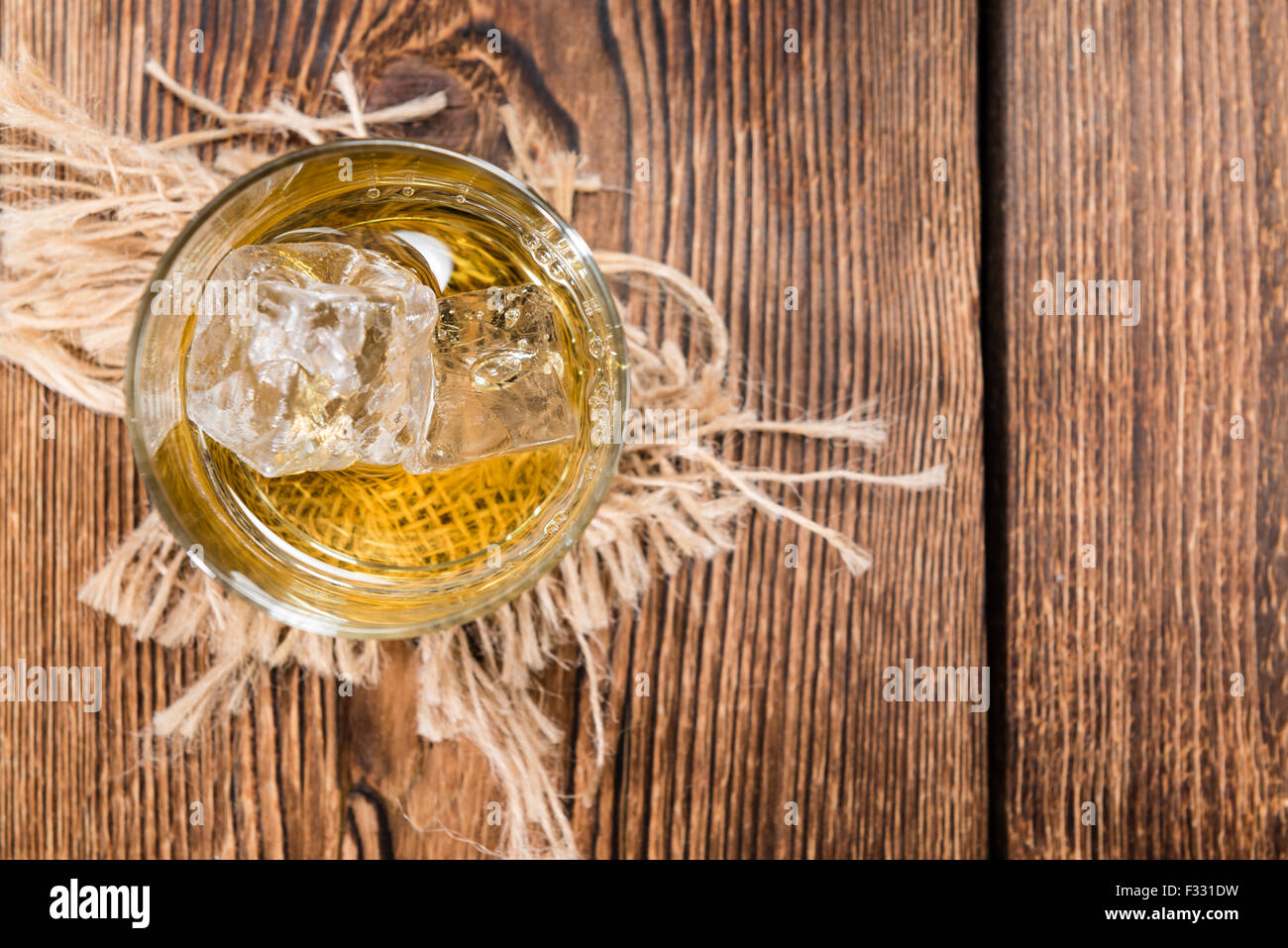 Apple Liqueur Shot (close-up shot) on dark wooden background Stock ...