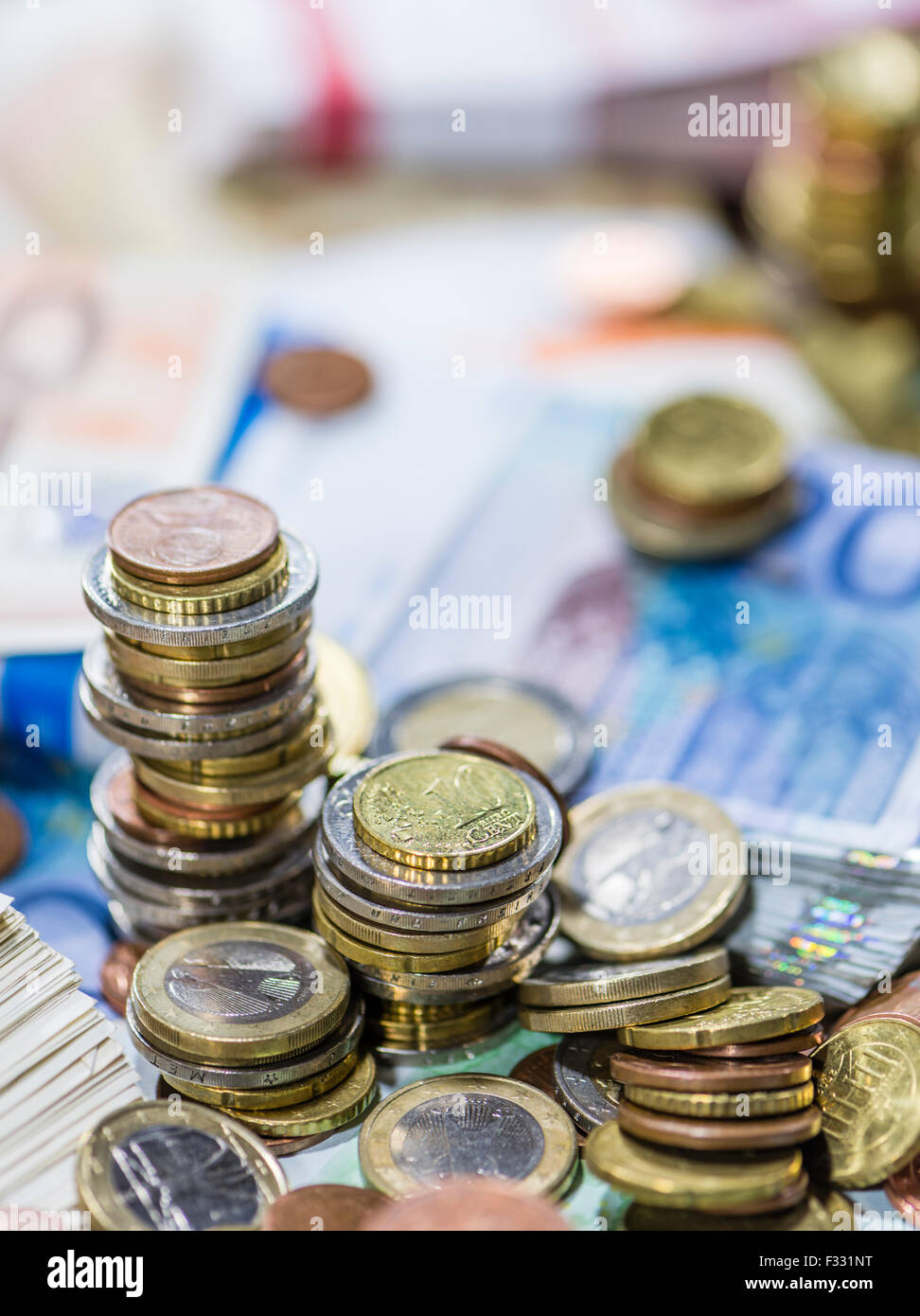 Stacked Euro Coins (on Banknotes) as detailed close-up shot Stock Photo ...