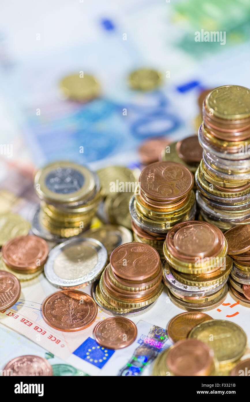 Stacked Euro Coins (on Banknotes) as detailed close-up shot Stock Photo ...