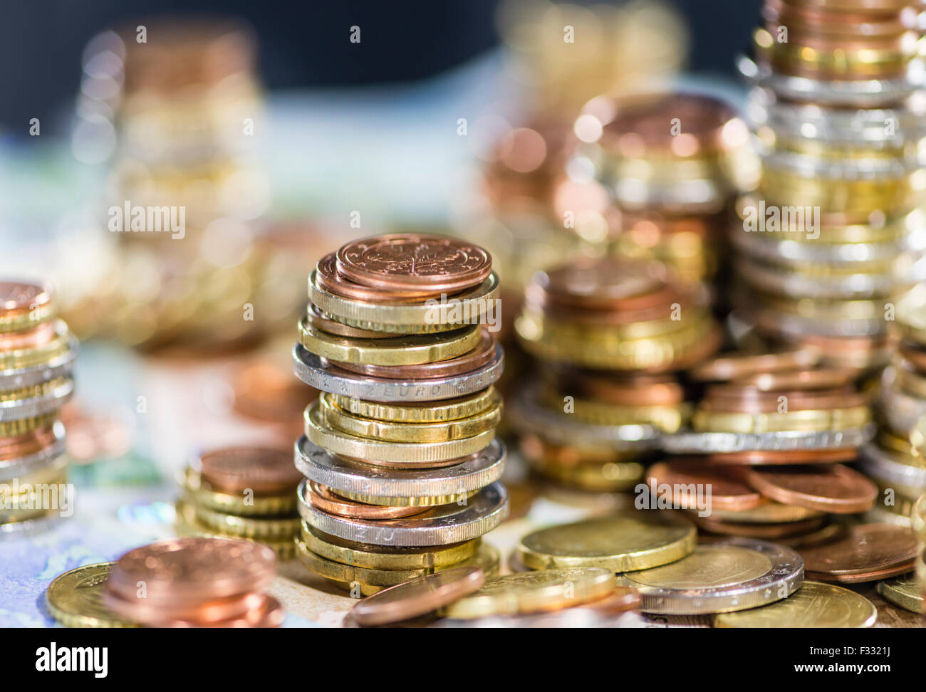 Stacked Euro Coins (on Banknotes) as detailed close-up shot Stock Photo ...