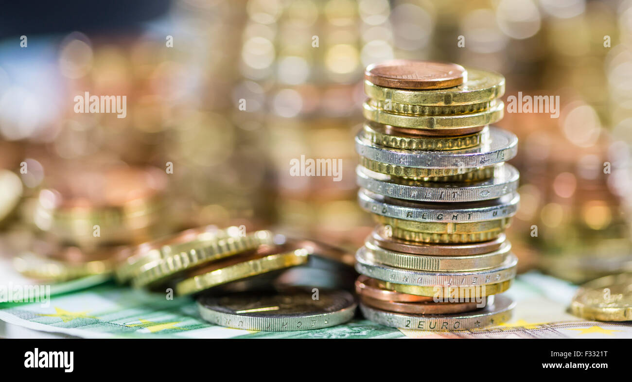 Stacked Euro Coins (on Banknotes) as detailed close-up shot Stock Photo ...