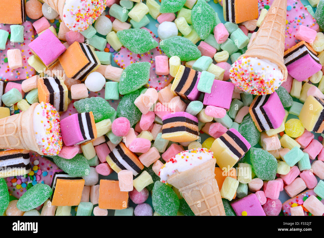 Bright colorful candy on pale blue wood table background overhead Stock ...
