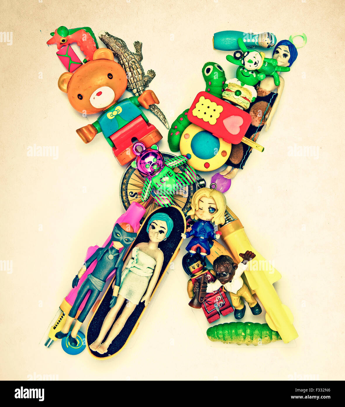 the letter X made from small toys Stock Photo - Alamy