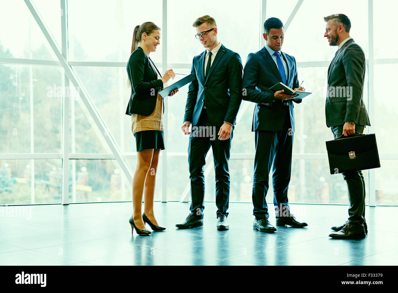 Business people asking and answering questions Stock Photo - Alamy