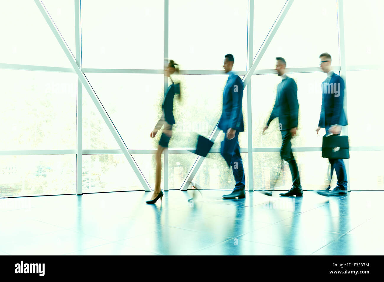Hurrying into office building hi-res stock photography and images - Alamy