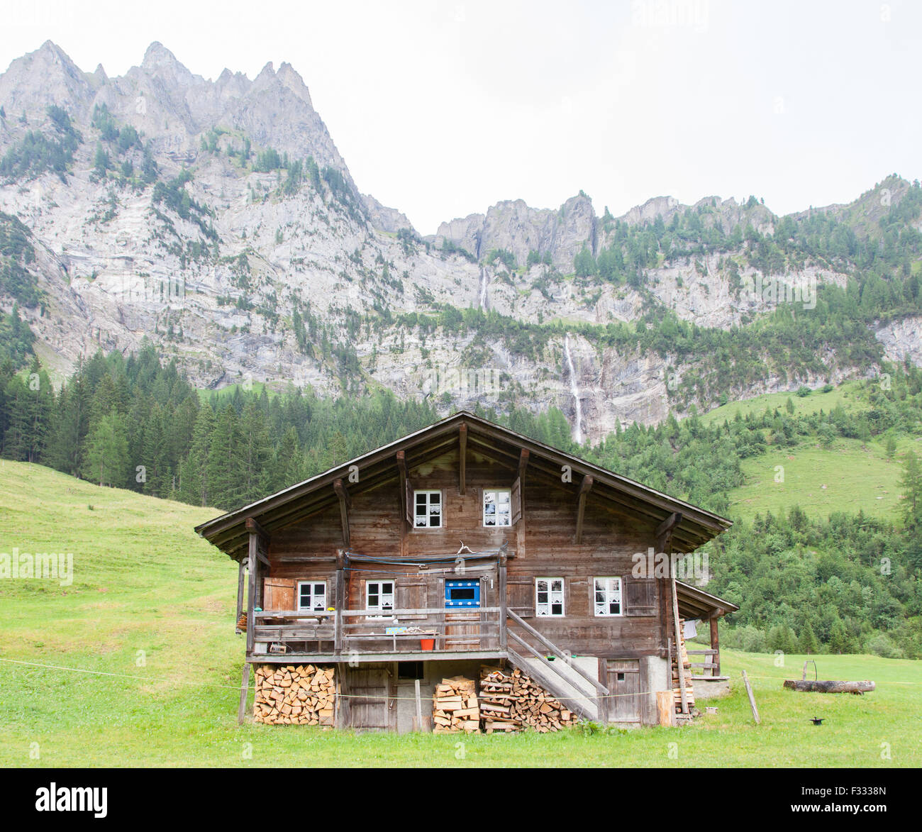 Typical house in the Swiss alps, rough country Stock Photo - Alamy
