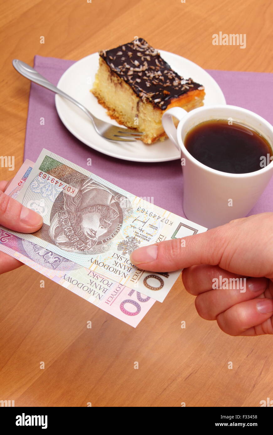 Paying for food in the cafe or restaurant, cheesecake and coffee ...