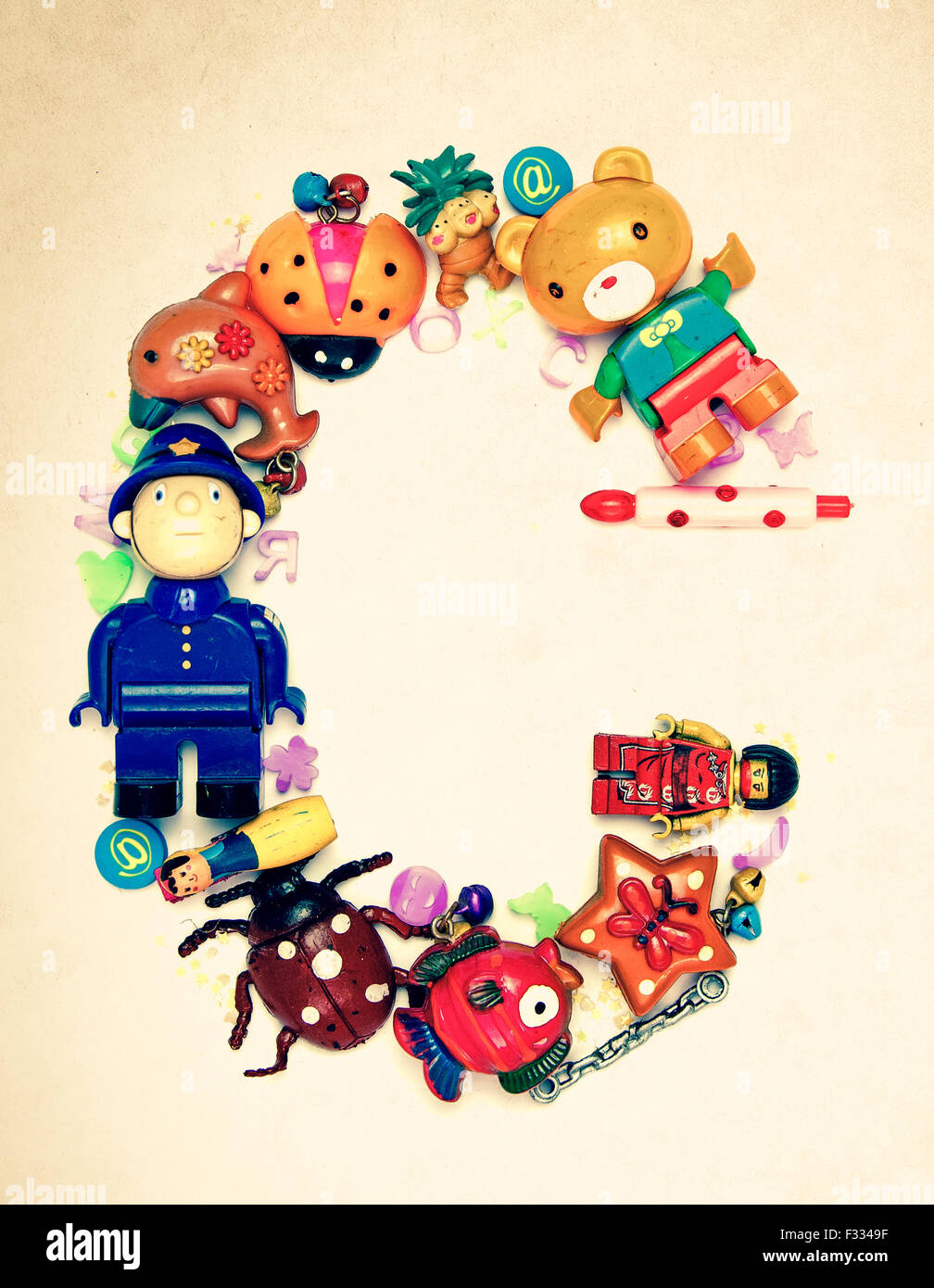 the letter C made from small toys Stock Photo - Alamy