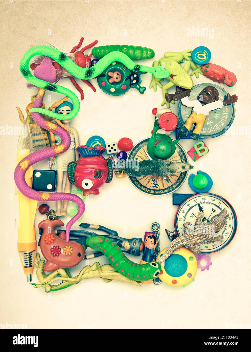 the letter B made from small toys Stock Photo - Alamy