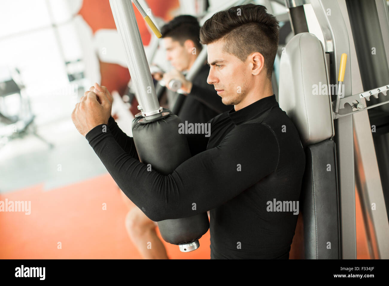 Young man in the gym Stock Photo - Alamy