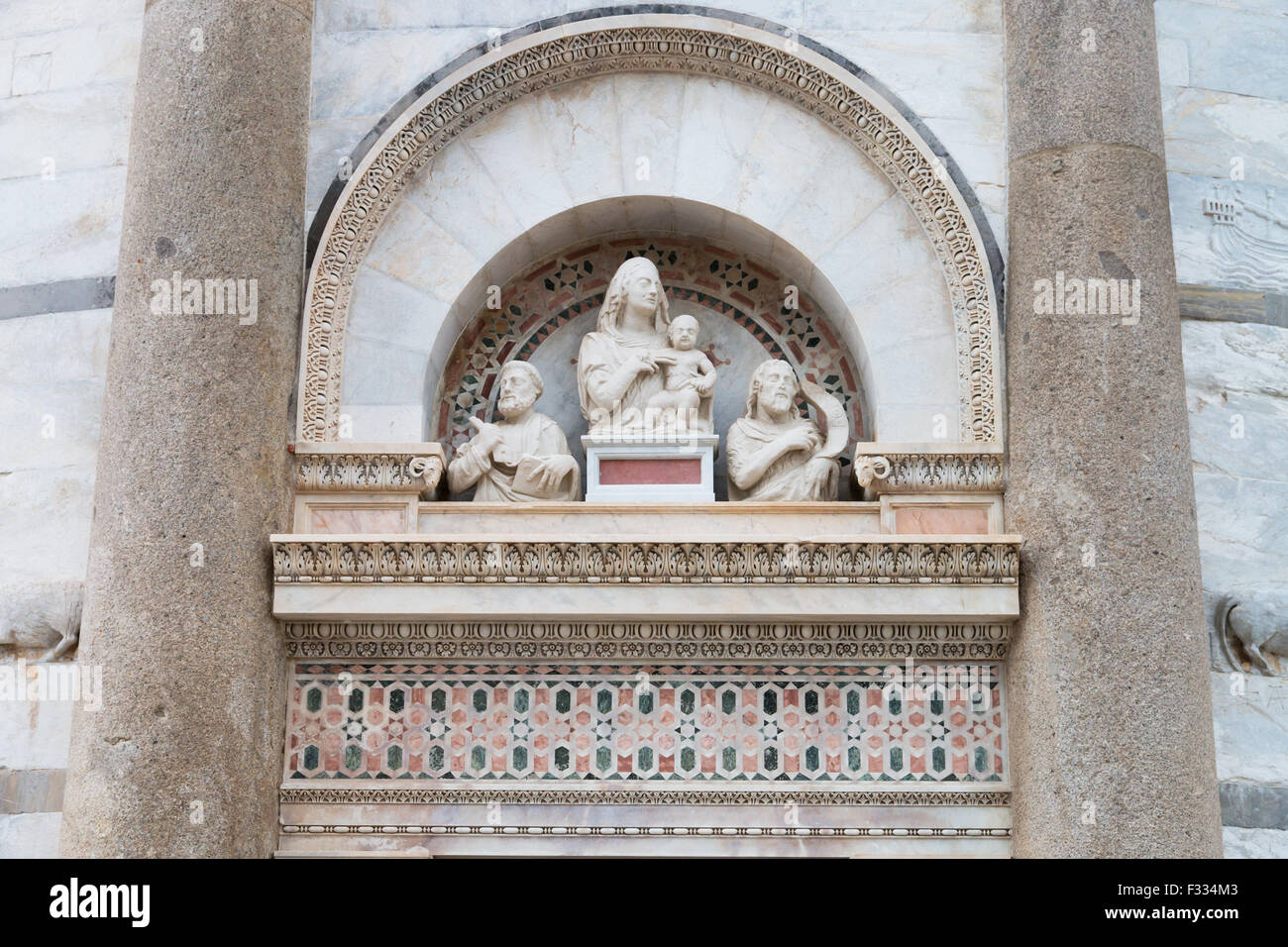 Pisa leaning tower arch and statues above the entrance door Stock Photo ...