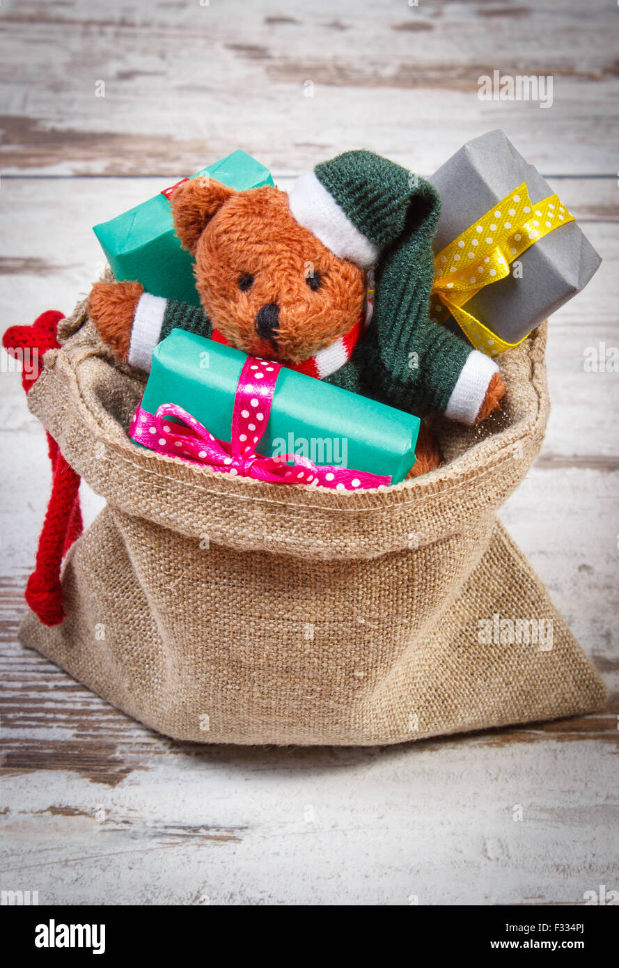Teddy bear and wrapped colorful gifts for Christmas, birthday ...