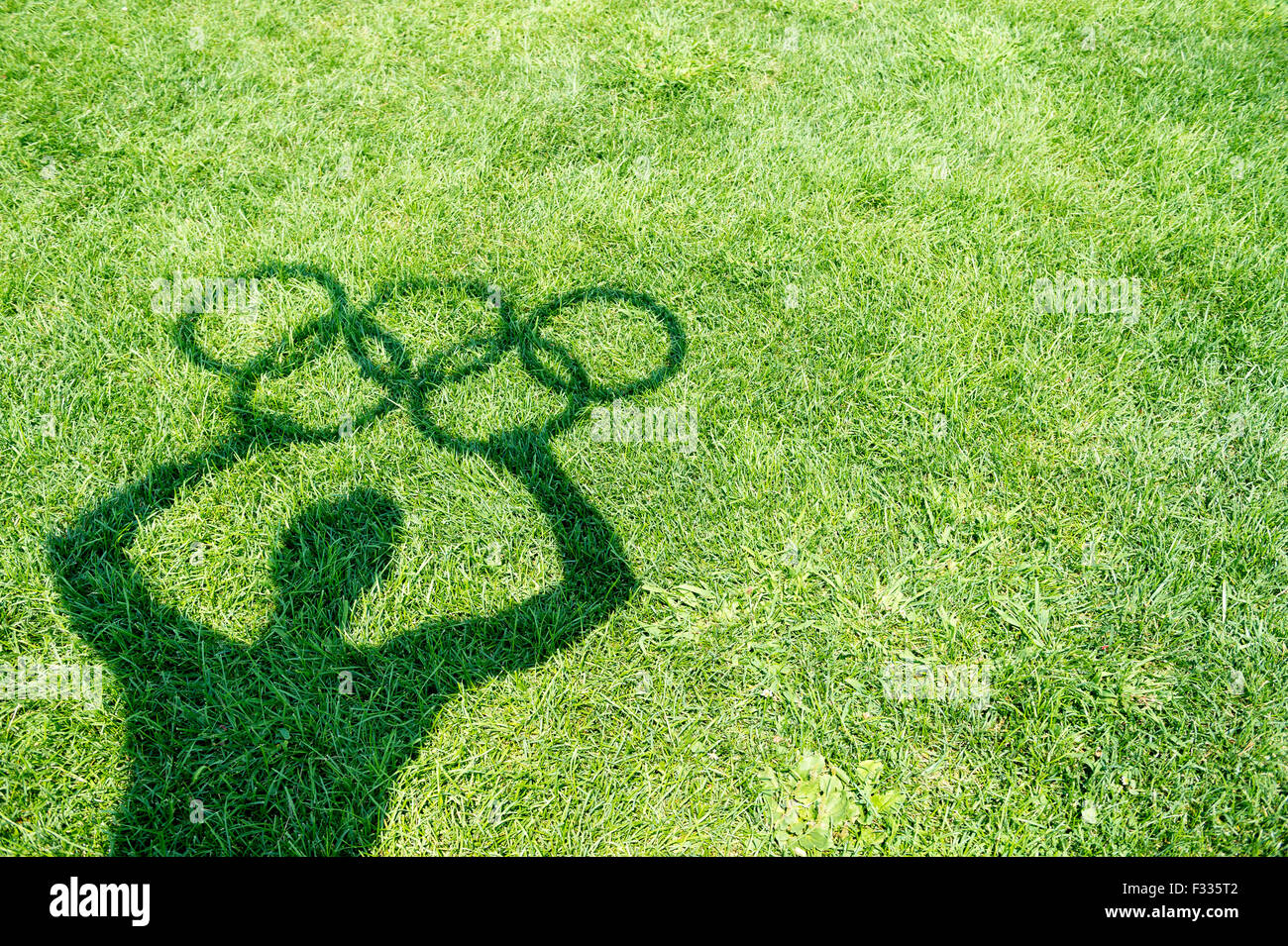 RIO DE JANEIRO, BRAZIL - MARCH 20, 2015: Shadow of a man holds Olympic ...