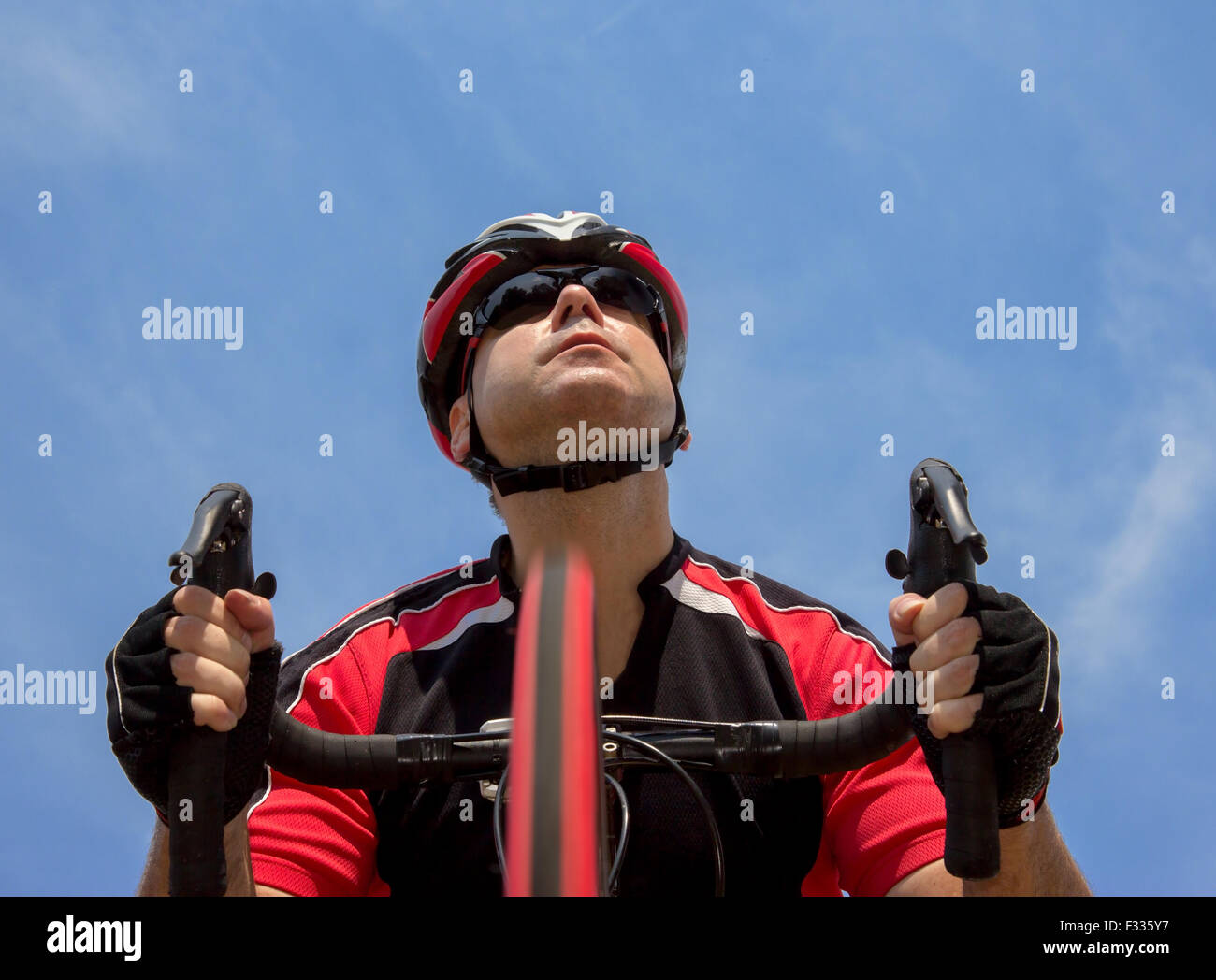 portrait of cyclist at blue background Stock Photo - Alamy