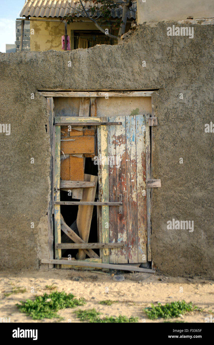 Crumbling cement house with broken door in ruins in Boa Vista on the ...