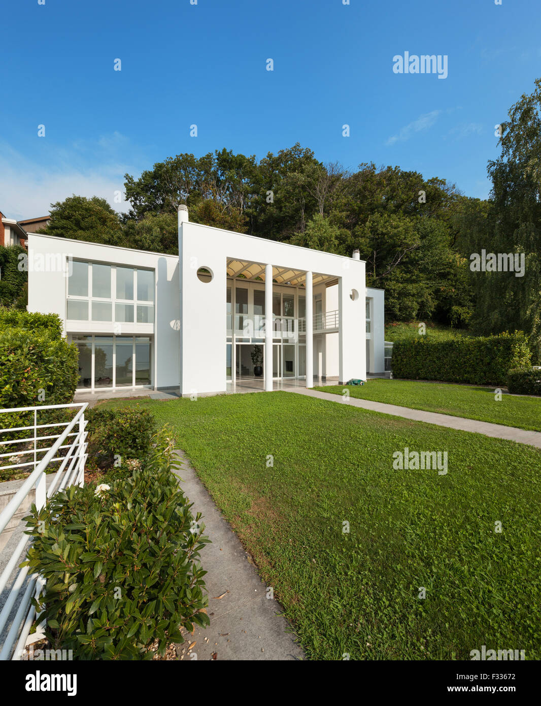 green garden of a white modern villa, external Stock Photo - Alamy