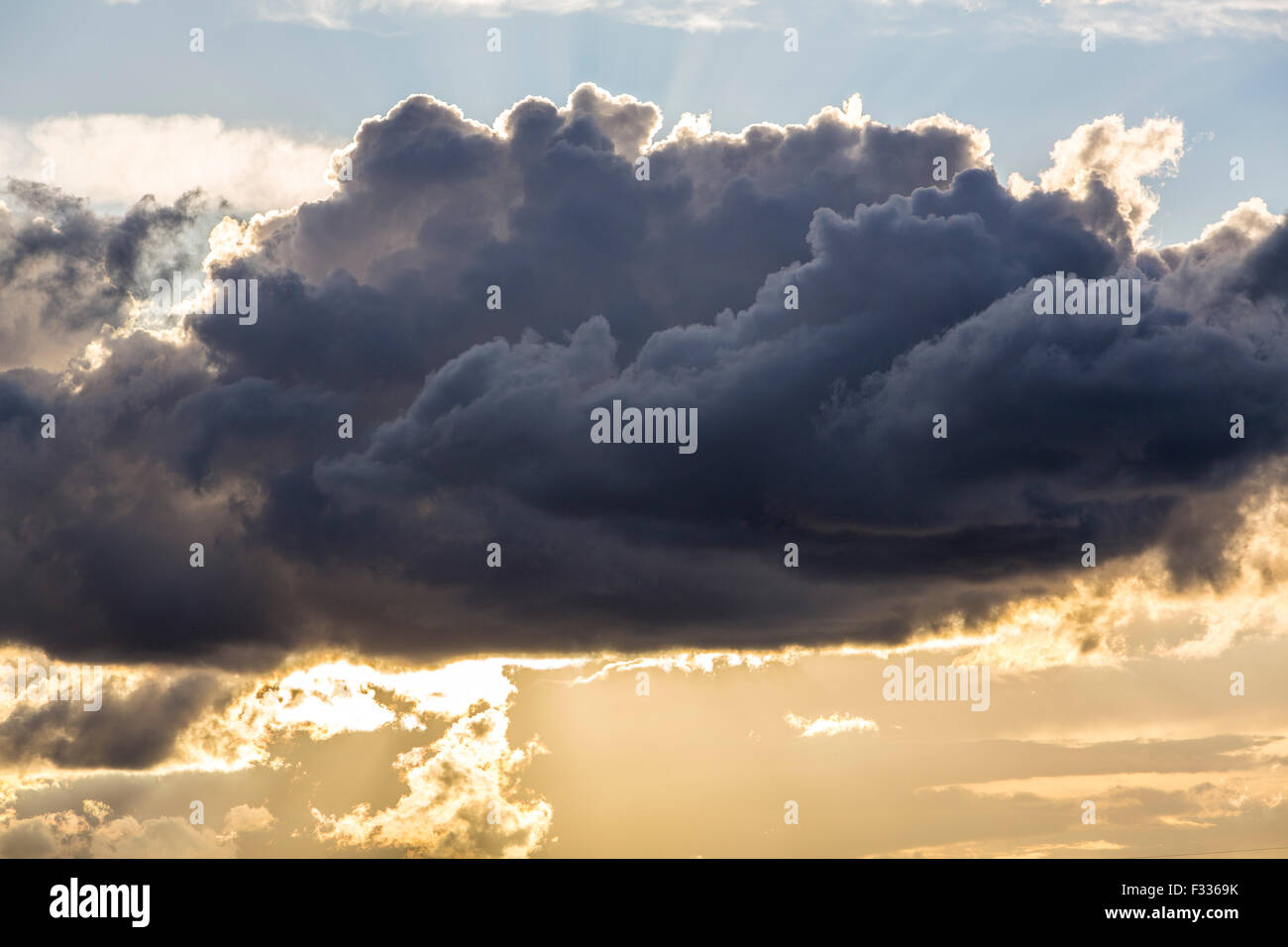 Thick, dark storm clouds in the evening sky Stock Photo - Alamy
