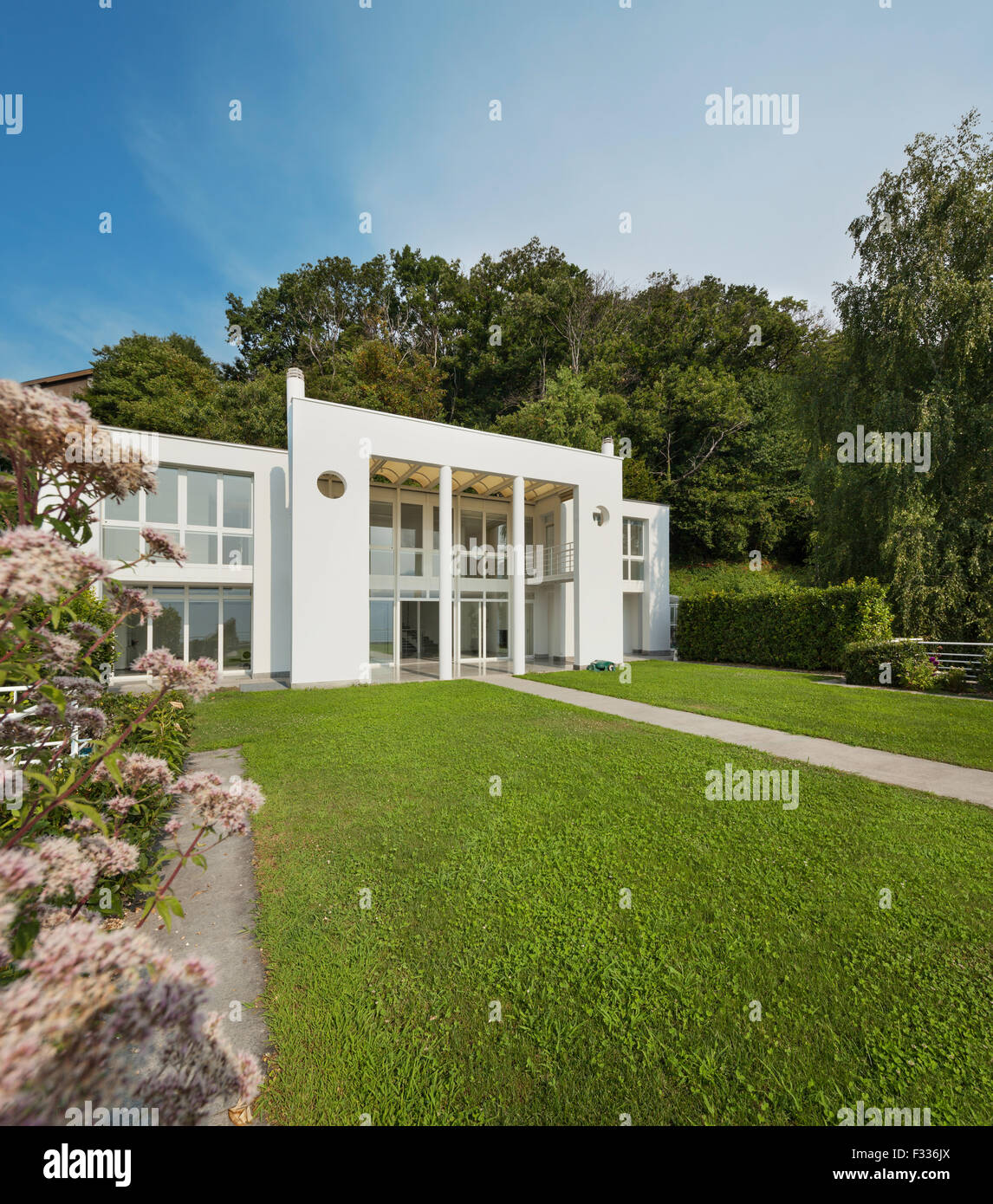 green garden of a white modern villa, external Stock Photo - Alamy