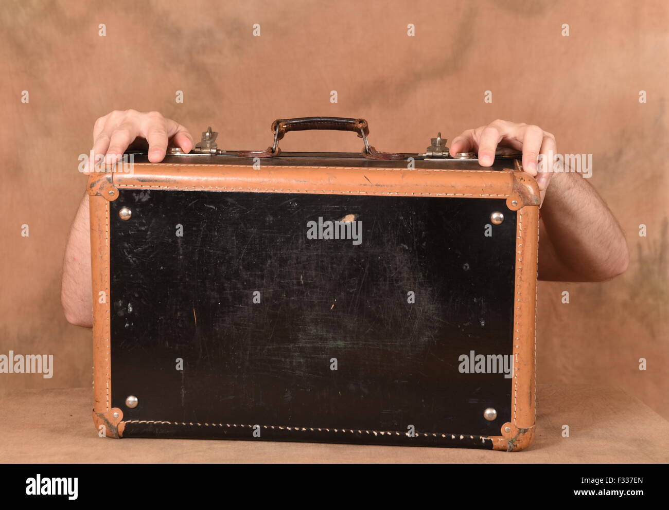 Tourist hand holding vintage leather hi-res stock photography and ...