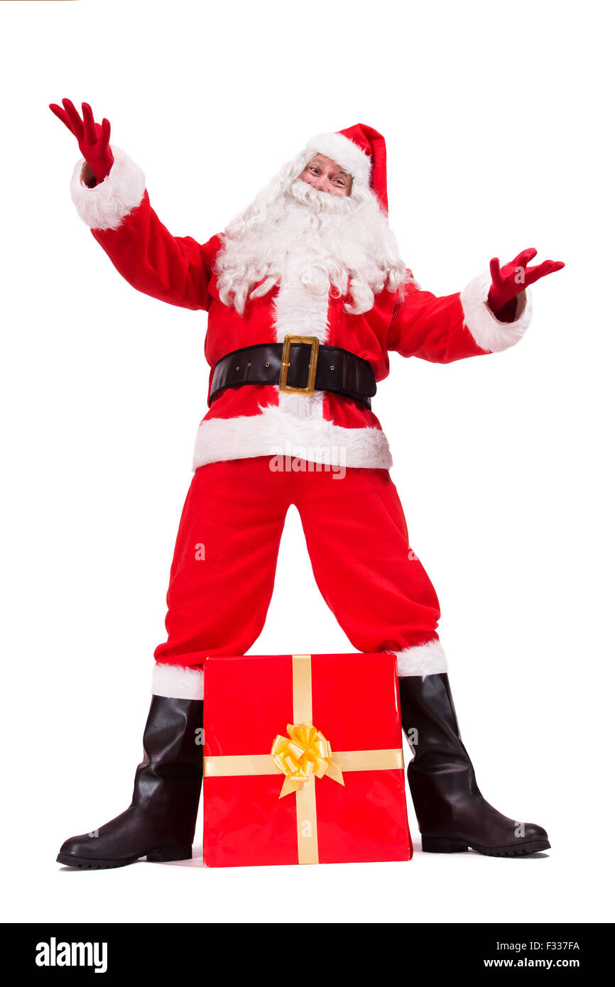 Santa Claus posing with Christmas gift Stock Photo - Alamy