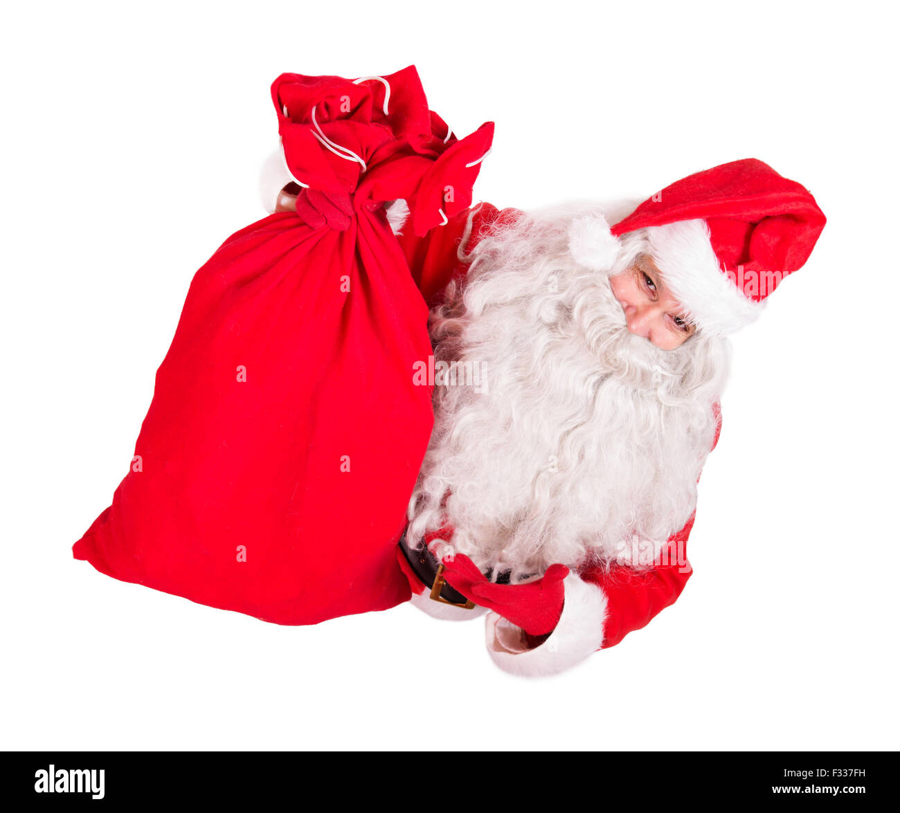 Santa Claus holding Christmas bag Stock Photo - Alamy