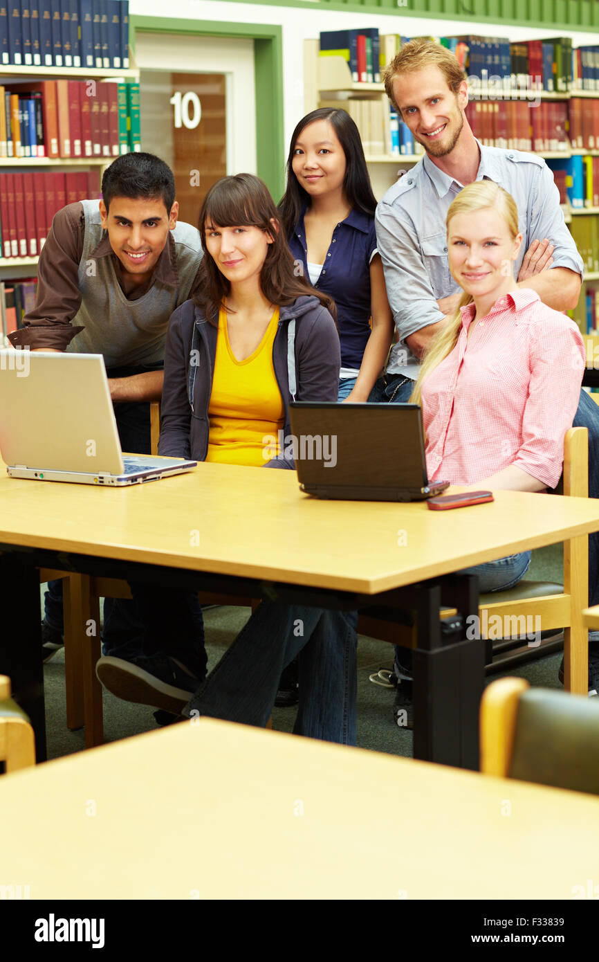 Group of students learning in library at university Stock Photo - Alamy
