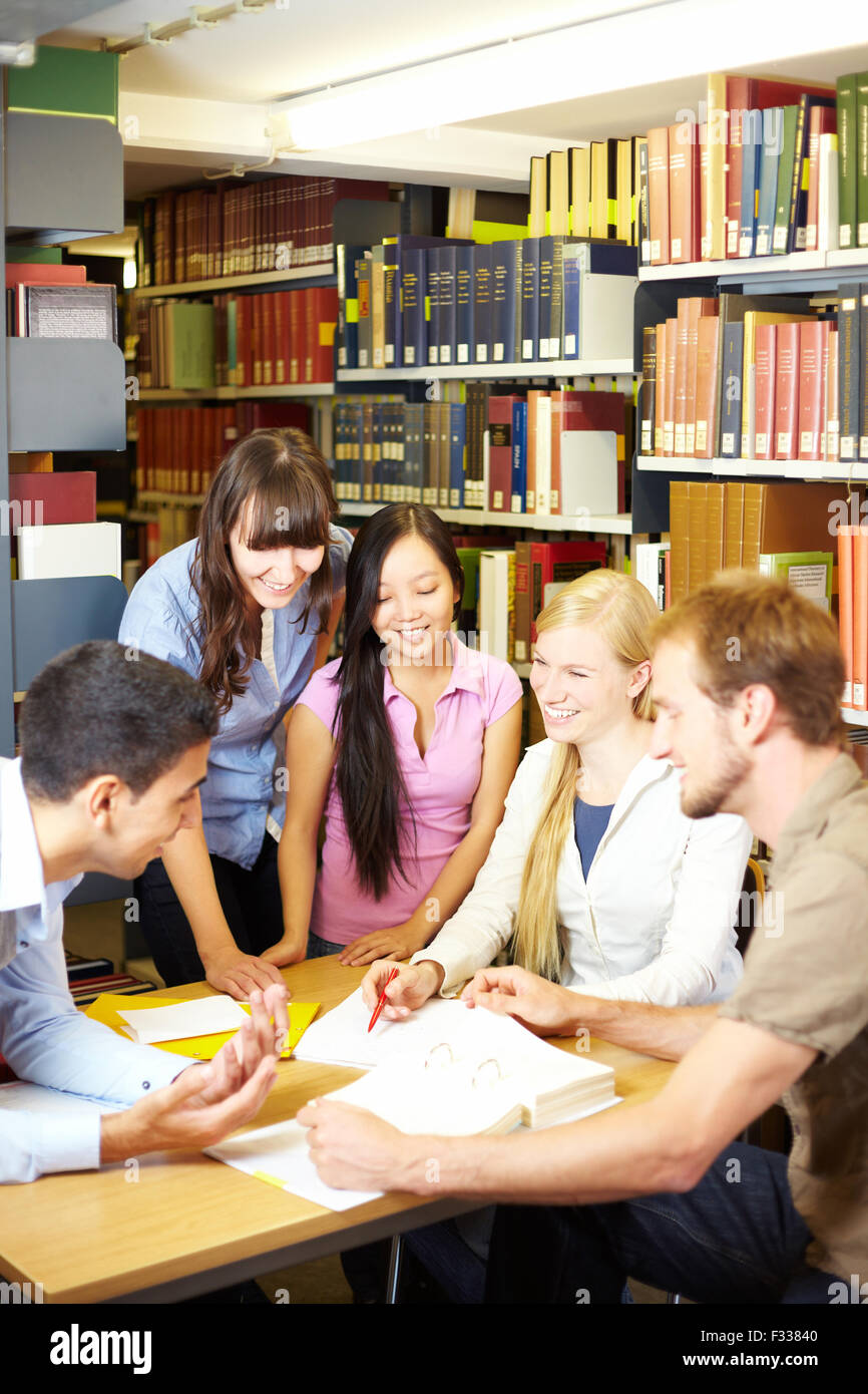 Group of students learning in library at university Stock Photo - Alamy