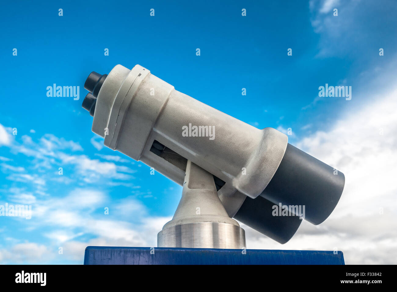 Tower viewer against blue cloudy sky Stock Photo - Alamy