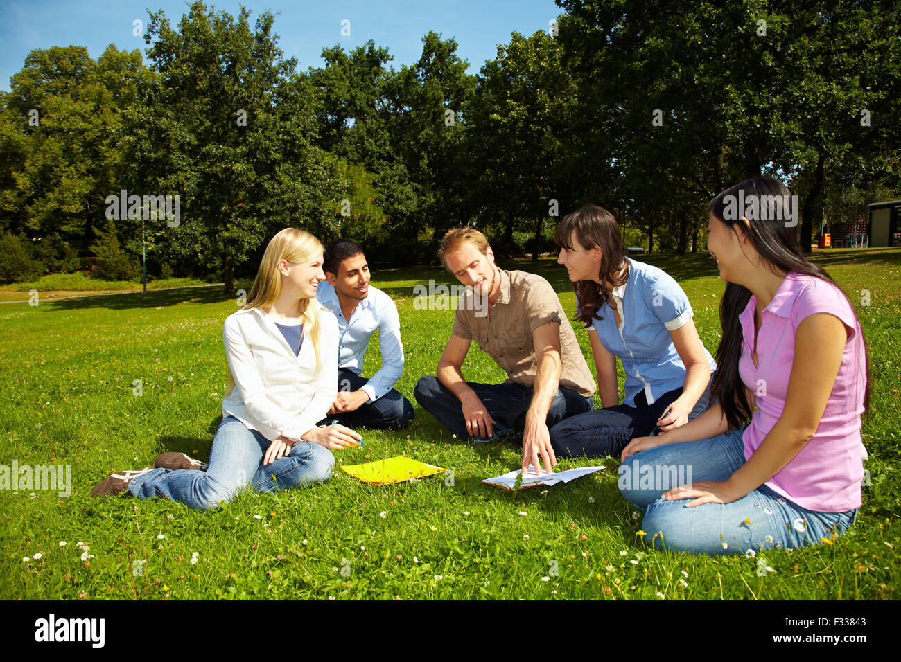 Group of students learning on campus of university Stock Photo - Alamy