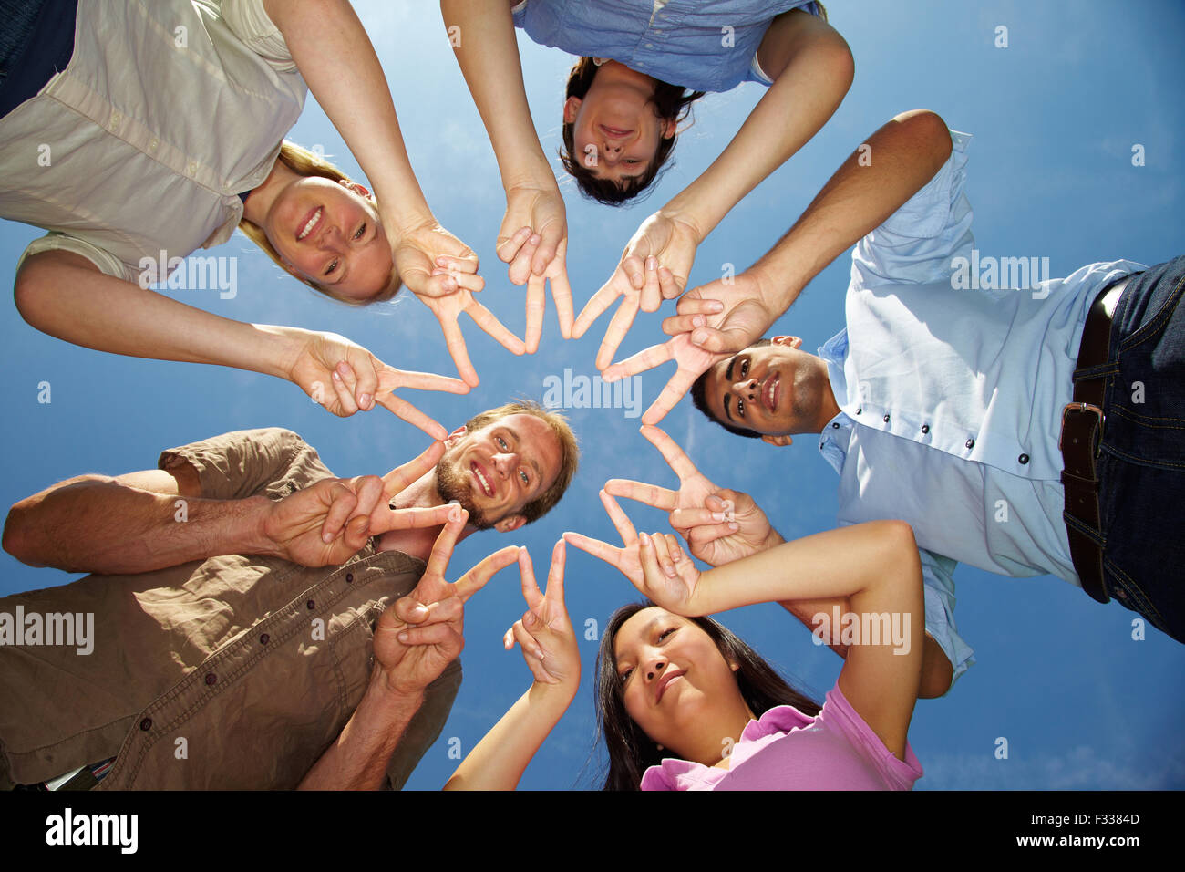 Five friends connecting their hands to star shape Stock Photo - Alamy