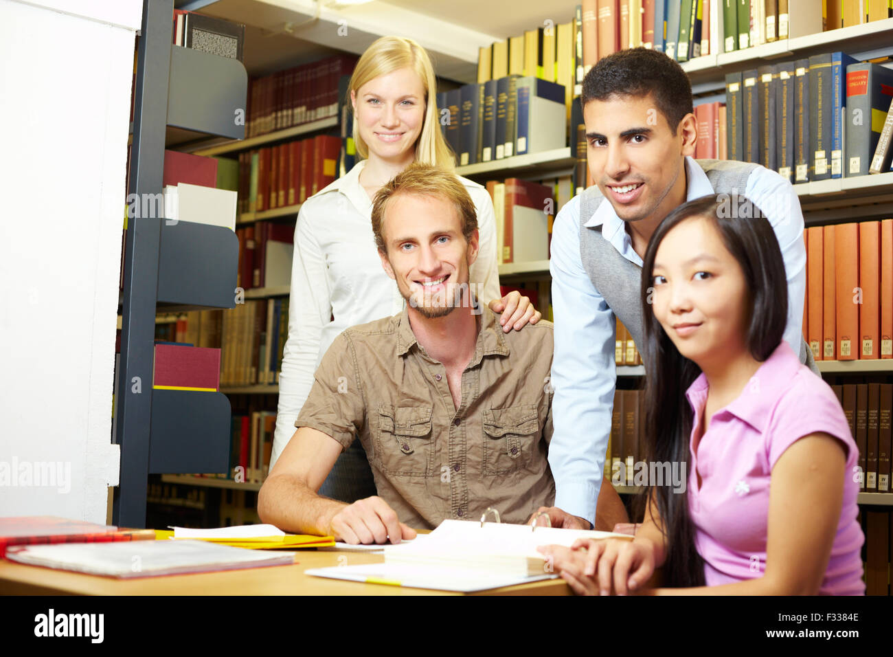 Group of students learning in library at university Stock Photo - Alamy