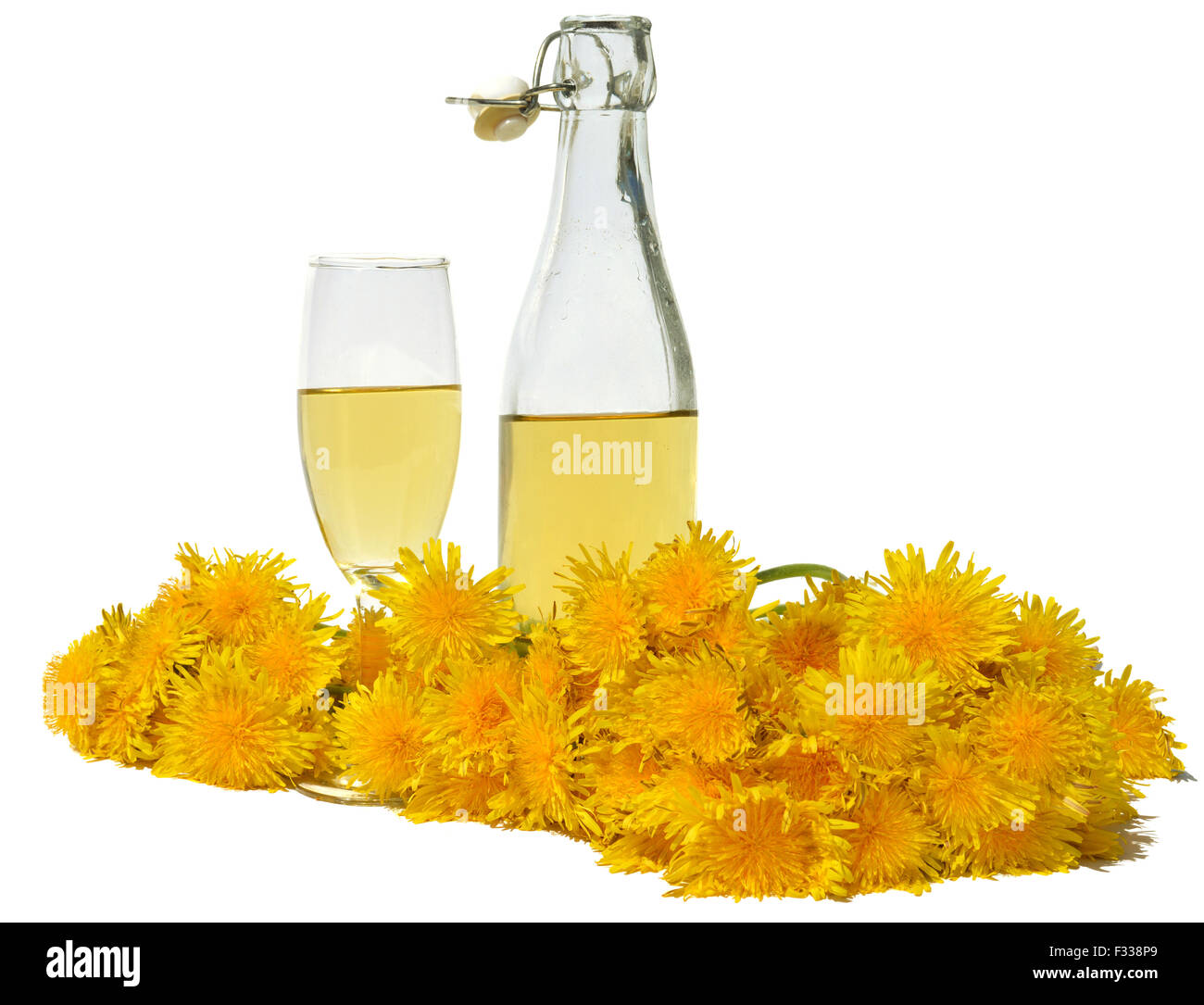 Dandelion Wine in glass and bottle Stock Photo - Alamy