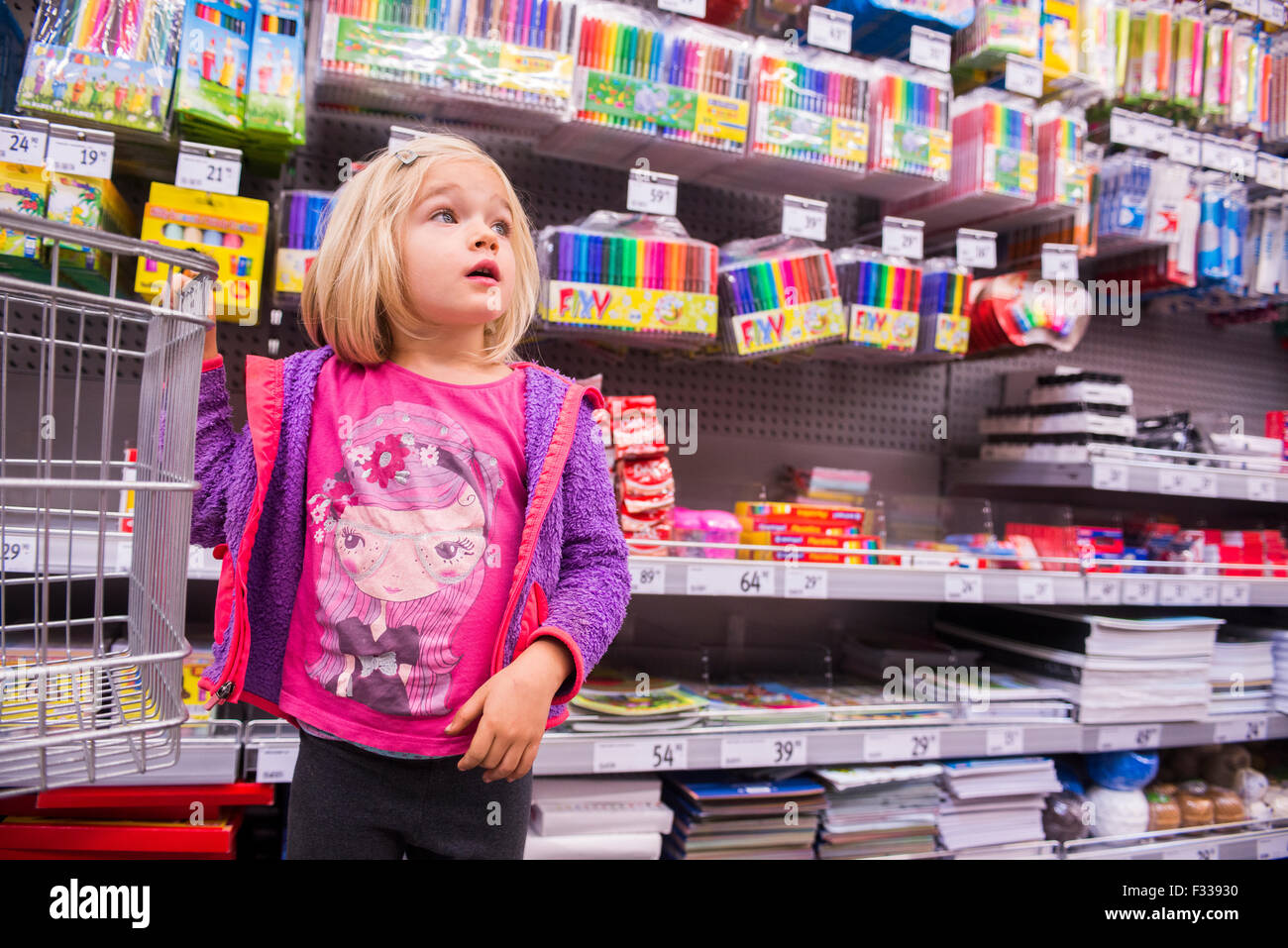 shopping for school supplies in a supermarket, educational stationery ...