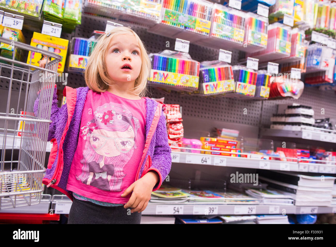shopping for school supplies in a supermarket, educational stationery ...