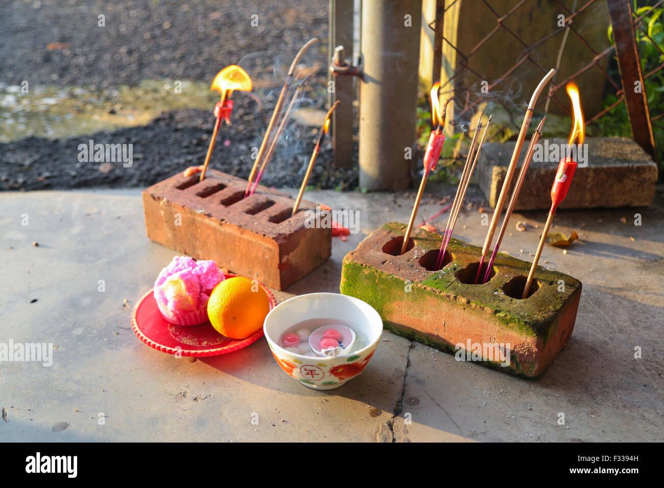 Chinese offering presented to earth god Stock Photo - Alamy