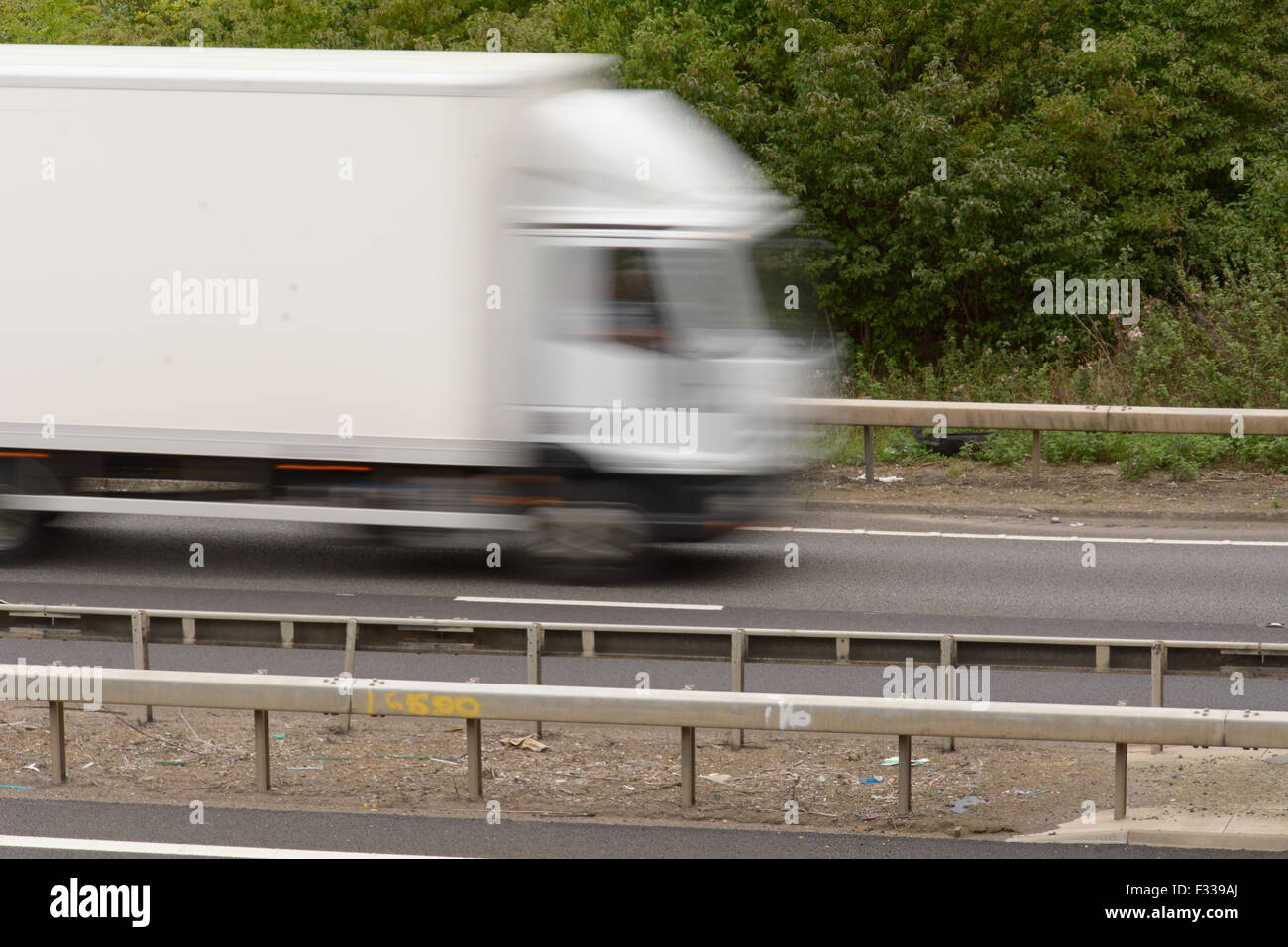 Lorry driving quickly on motorway blur Stock Photo - Alamy