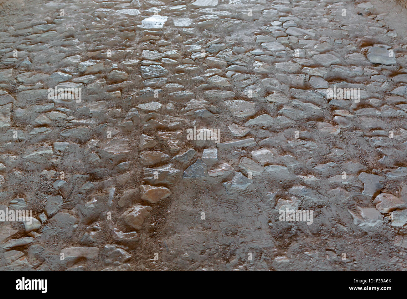 Old paved road with natural stone plates Stock Photo - Alamy