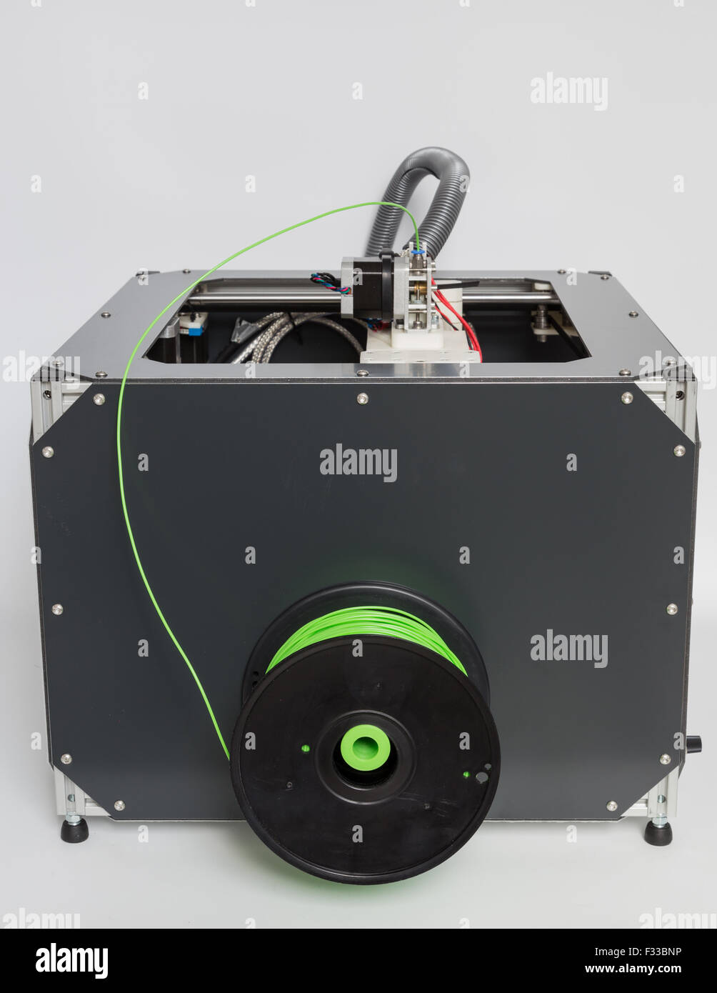 3d printer with bright green filament Stock Photo - Alamy