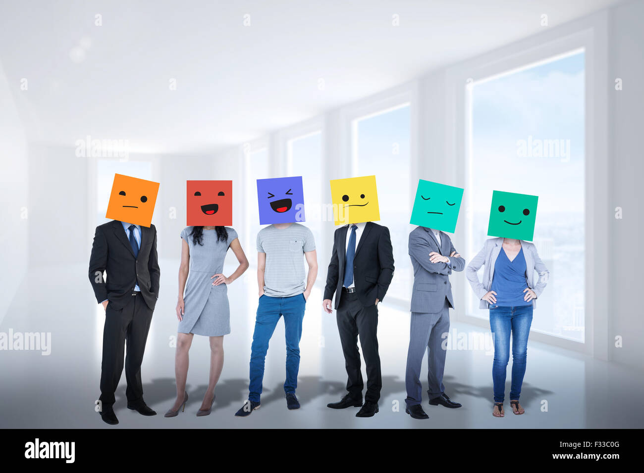 Composite image of people with boxes on their heads Stock Photo - Alamy