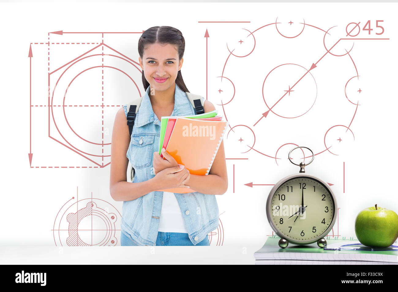 Composite image of student holding notebooks Stock Photo - Alamy