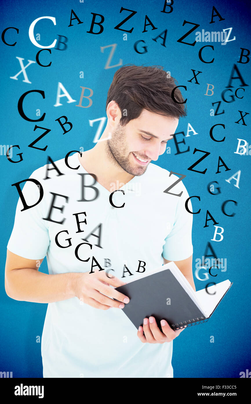 Composite image of student reading book Stock Photo - Alamy