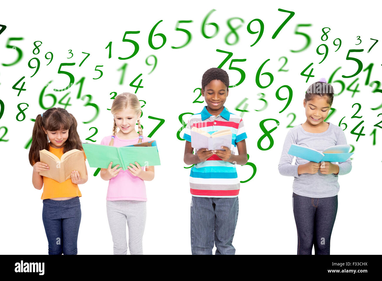 Composite image of elementary pupils reading Stock Photo - Alamy