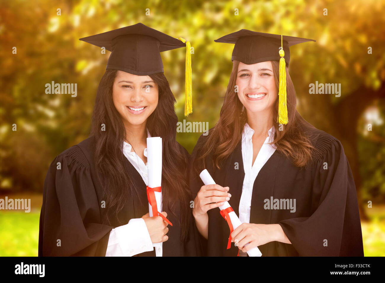 Composite image of two friends stand together after graduating Stock ...
