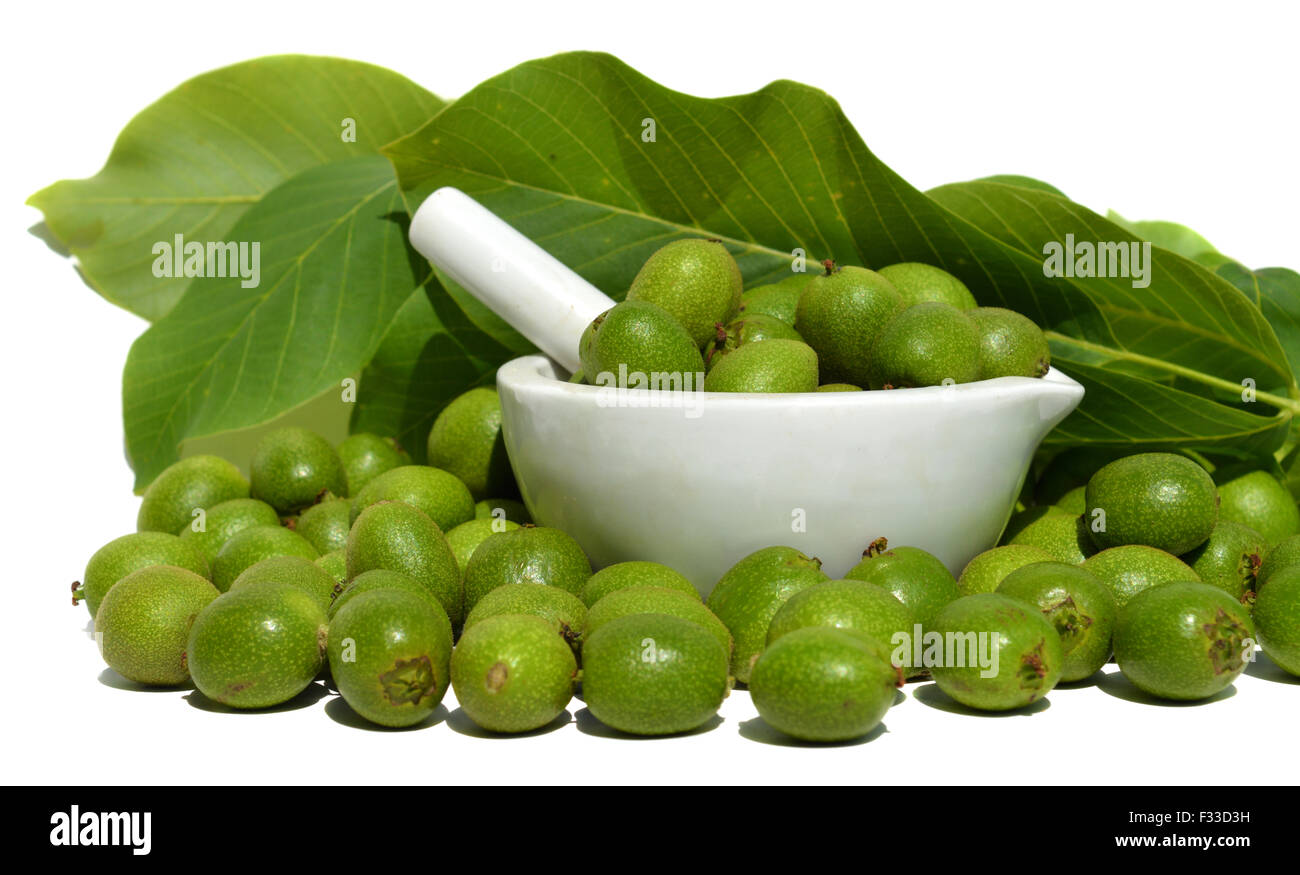 Walnuts in green husks hi-res stock photography and images - Alamy