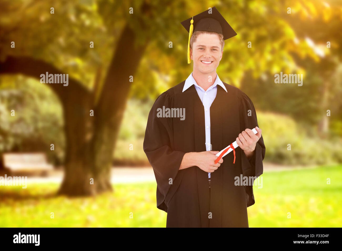 Composite image of man smiling as he has just graduated with his degree ...