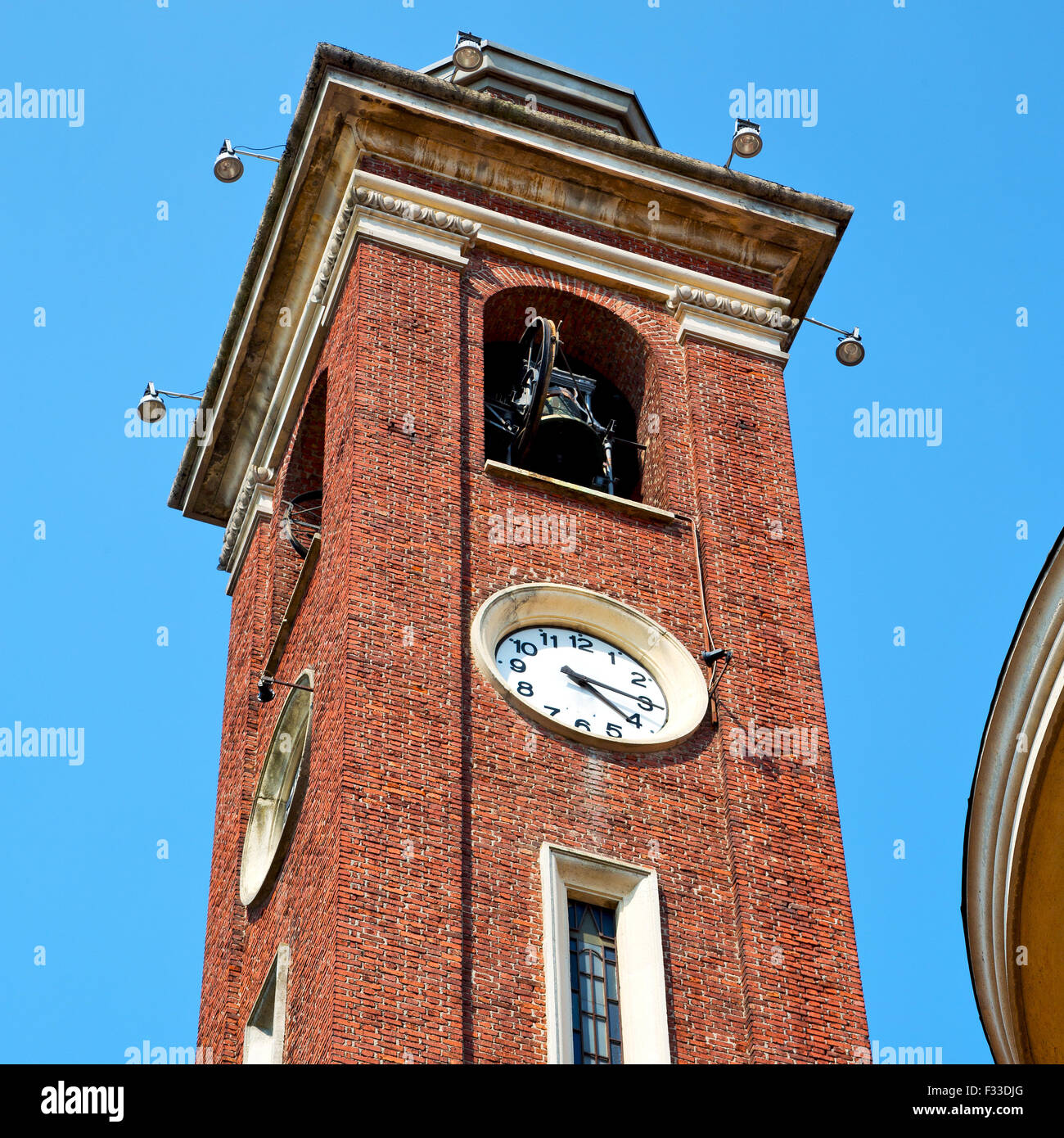 ancien clock tower in italy europe old stone and bell Stock Photo - Alamy