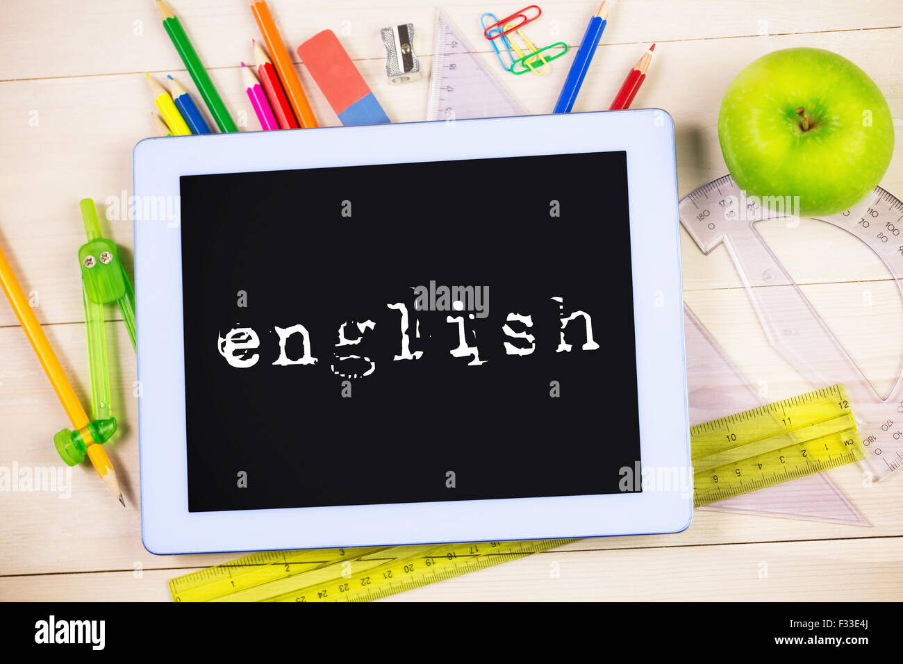 English against students table with school supplies Stock Photo - Alamy