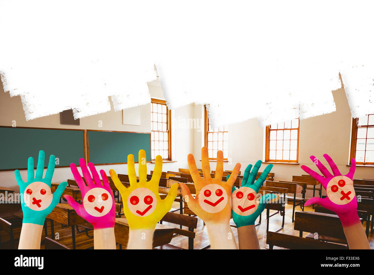 Composite image of hands with colourful smiley faces Stock Photo - Alamy