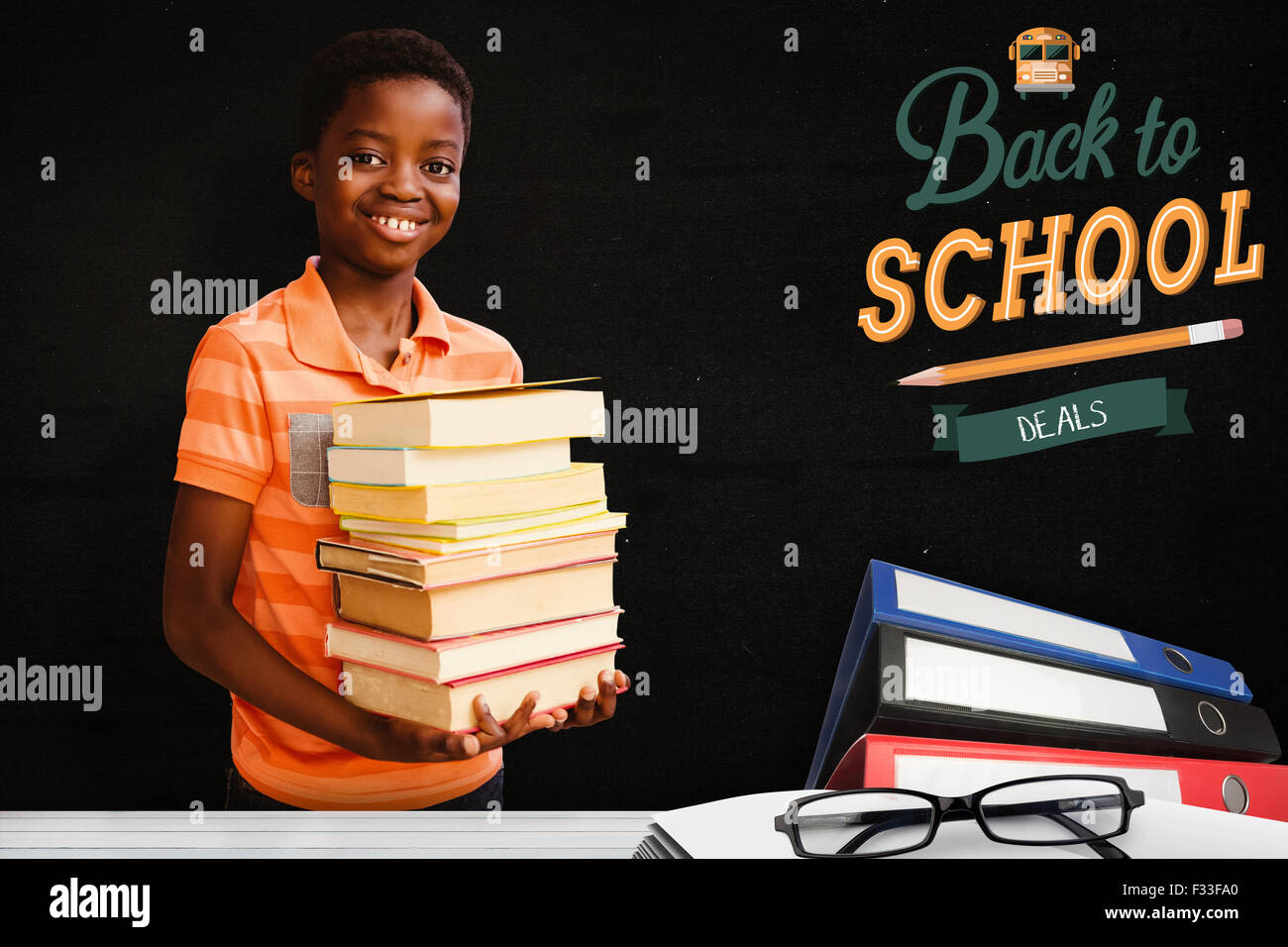 Composite image of portrait of cute boy carrying books in library Stock ...