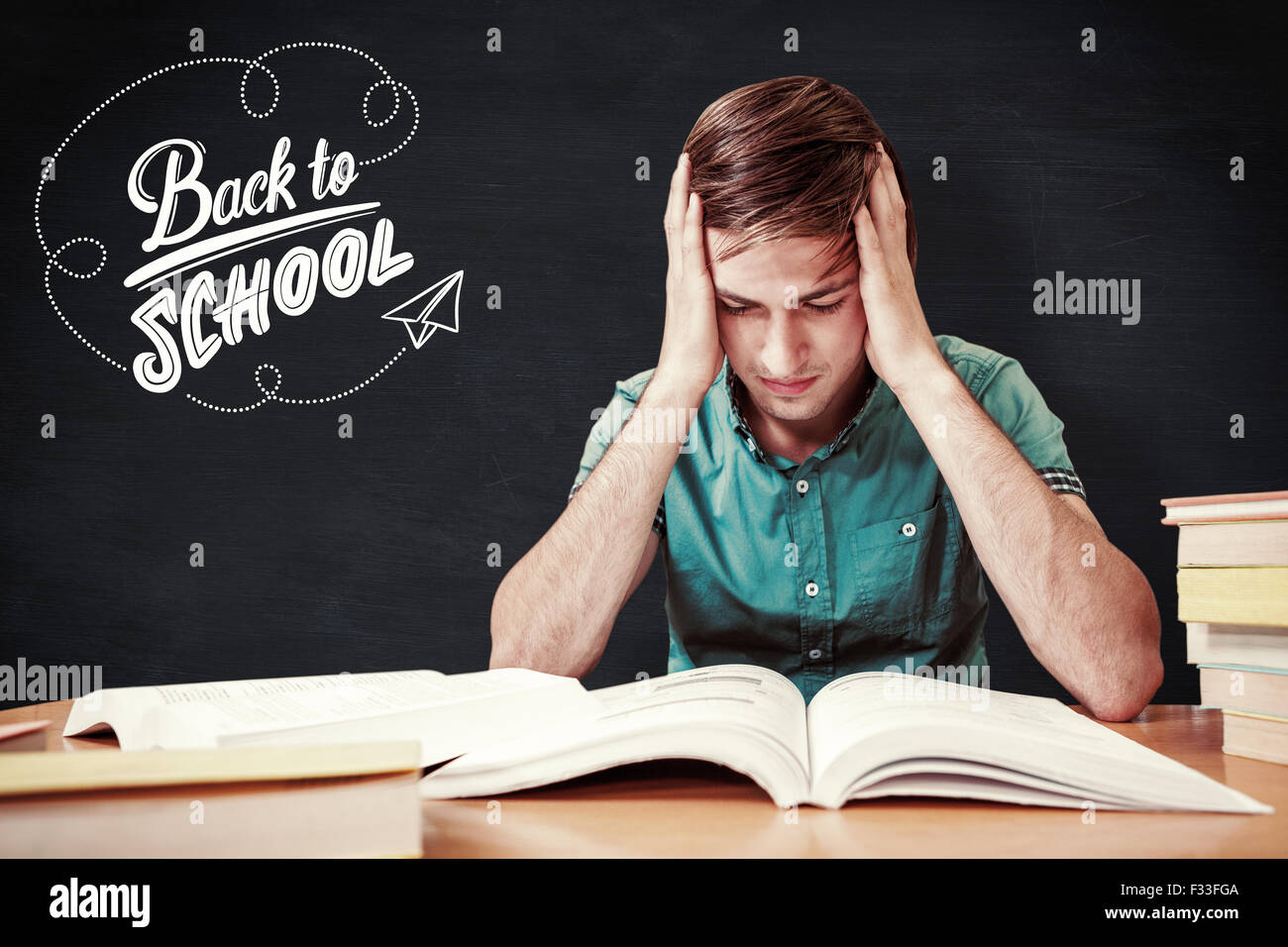 Composite image of student sitting in library reading Stock Photo - Alamy
